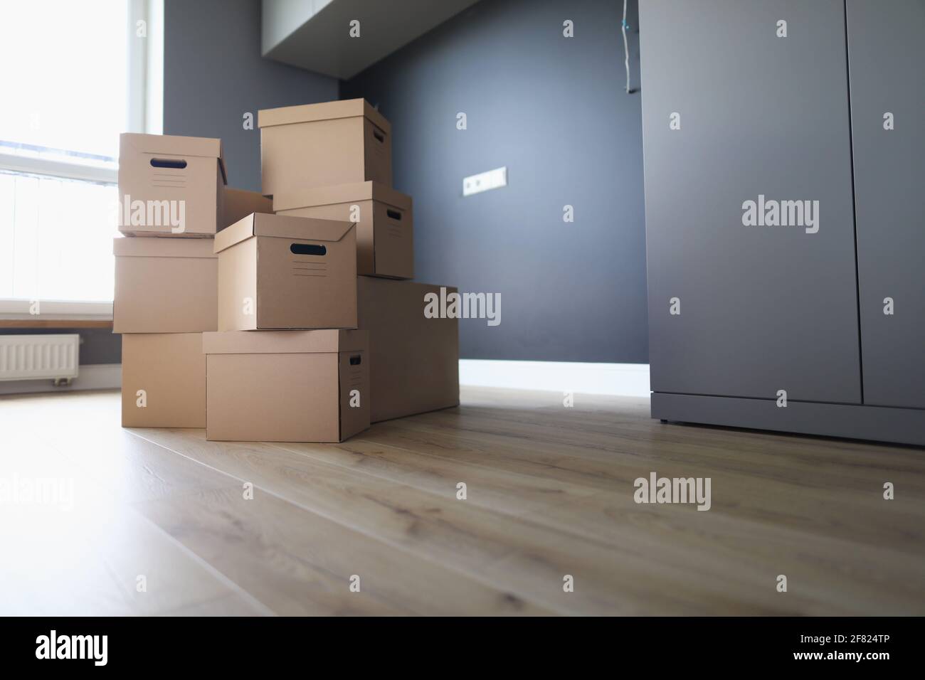 Large number of cardboard boxes are in room Stock Photo - Alamy