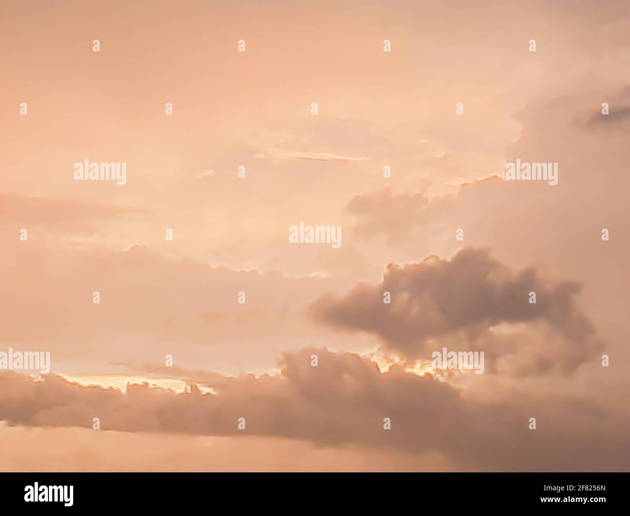 Full frame cloudscape background with dark distinctive cloud shapes and ...