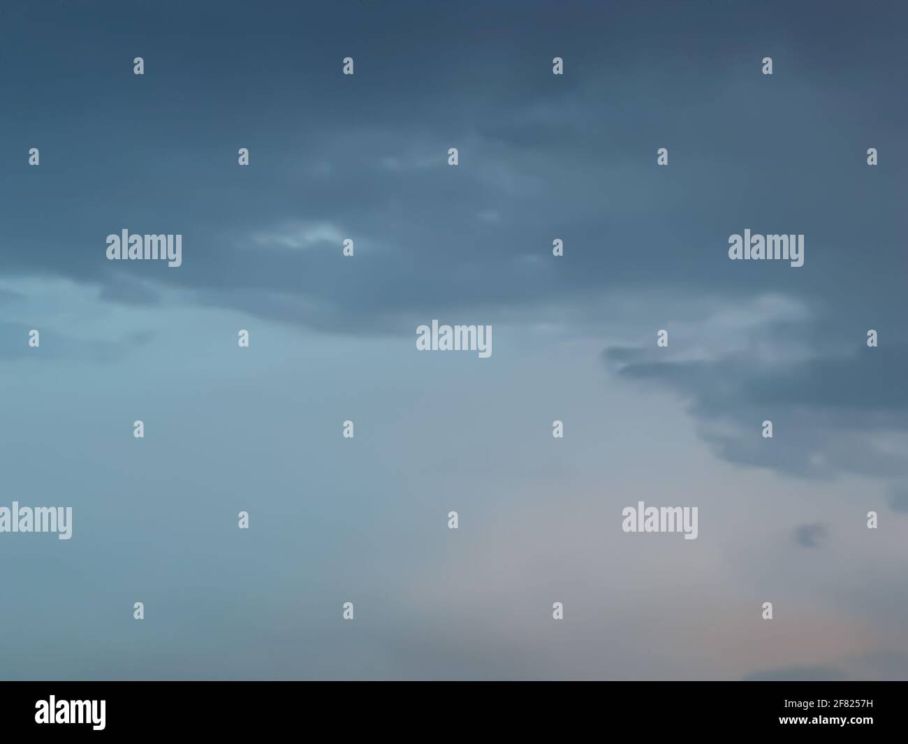 Full frame cloudscape background with smooth cloud shapes, grey white ...