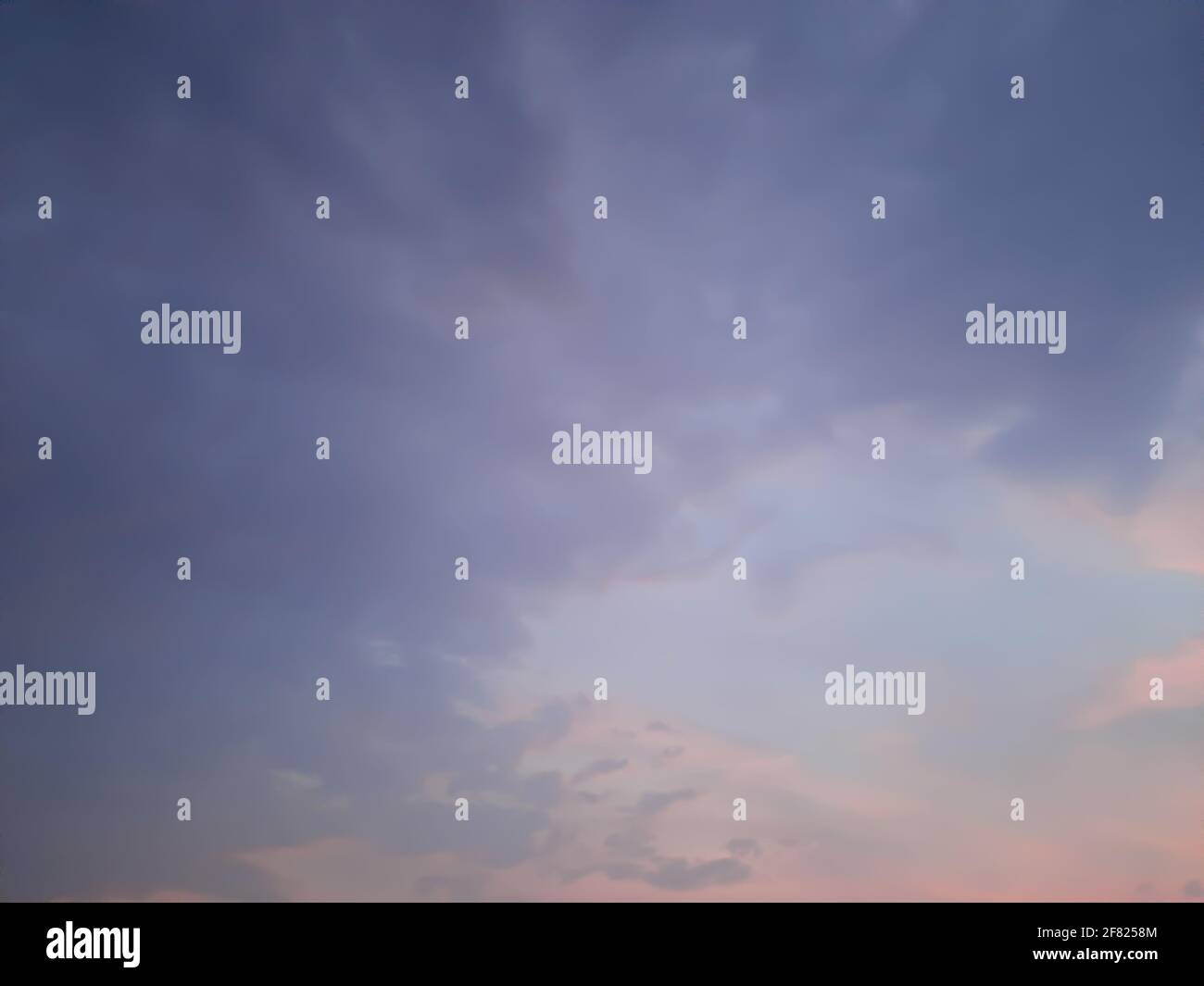 Full frame cloudscape background with smooth cloud shapes, grey white sky and sunlight Stock ...