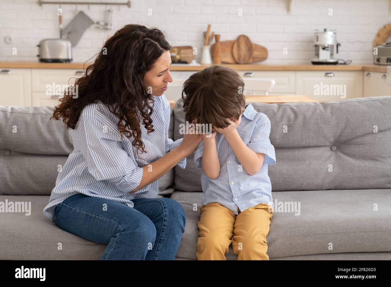Closeup of worried mother calm weeping kid. Upset little boy cry ...