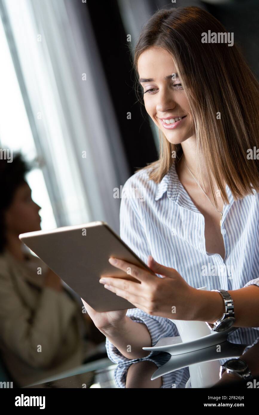 Successful businesswoman sitting cafe hi-res stock photography and ...