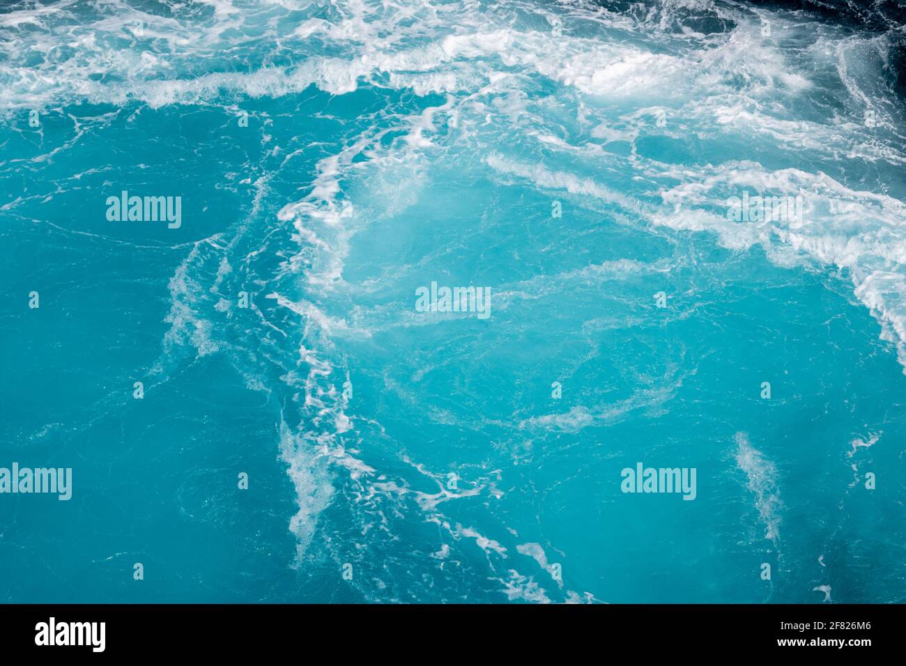 Surface of the sea. Natural texture of blue foaming sea water ...