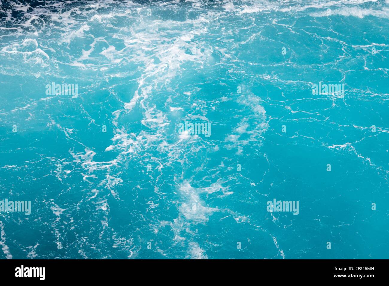 Surface of the sea. Natural texture of blue foaming sea water ...