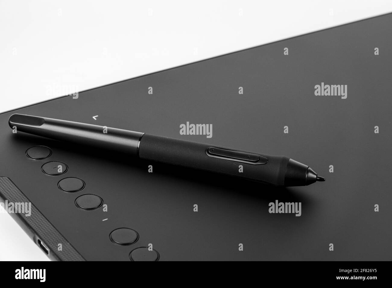 Black graphic tablet with pen for illustrators, designers and ...