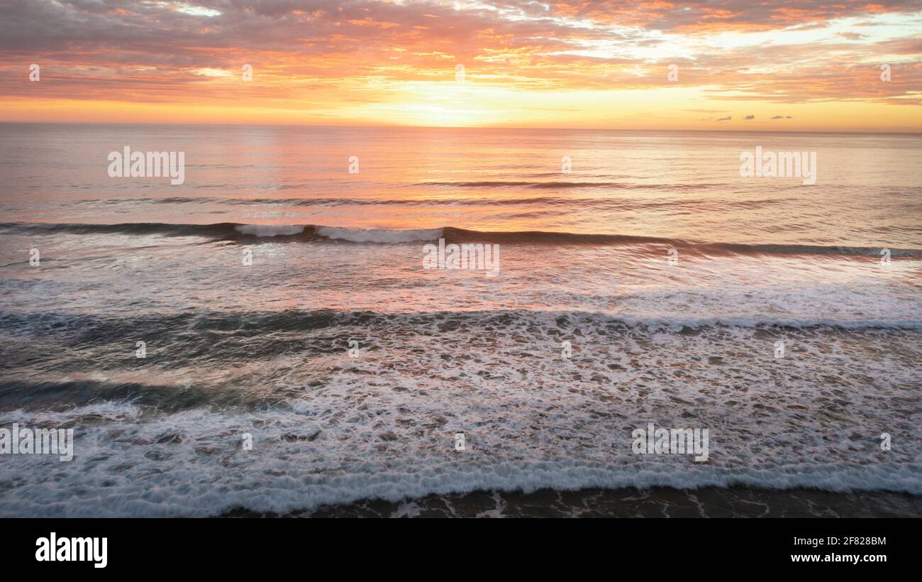 Waves with Sunrise Stock Photo - Alamy
