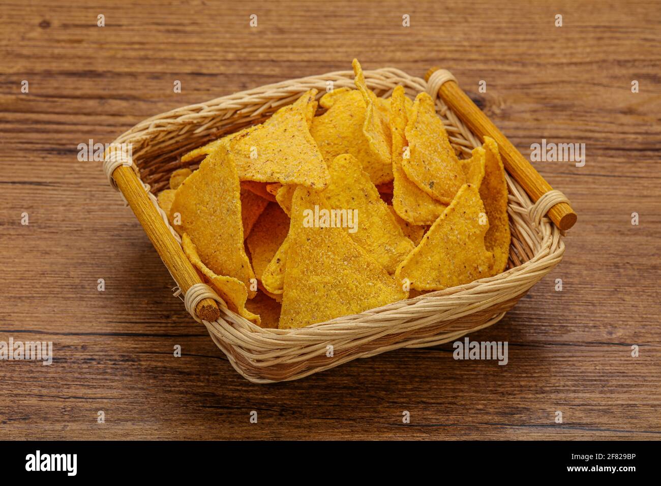 Mexican crunchy corn nachos triangle heap Stock Photo - Alamy