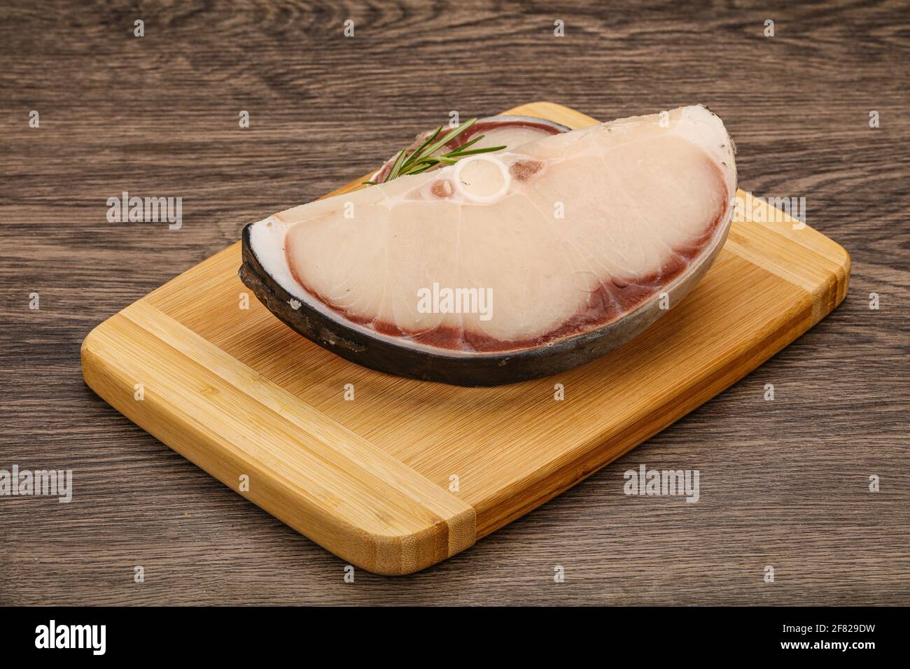 Raw shark steak served rosemary for cooking Stock Photo - Alamy