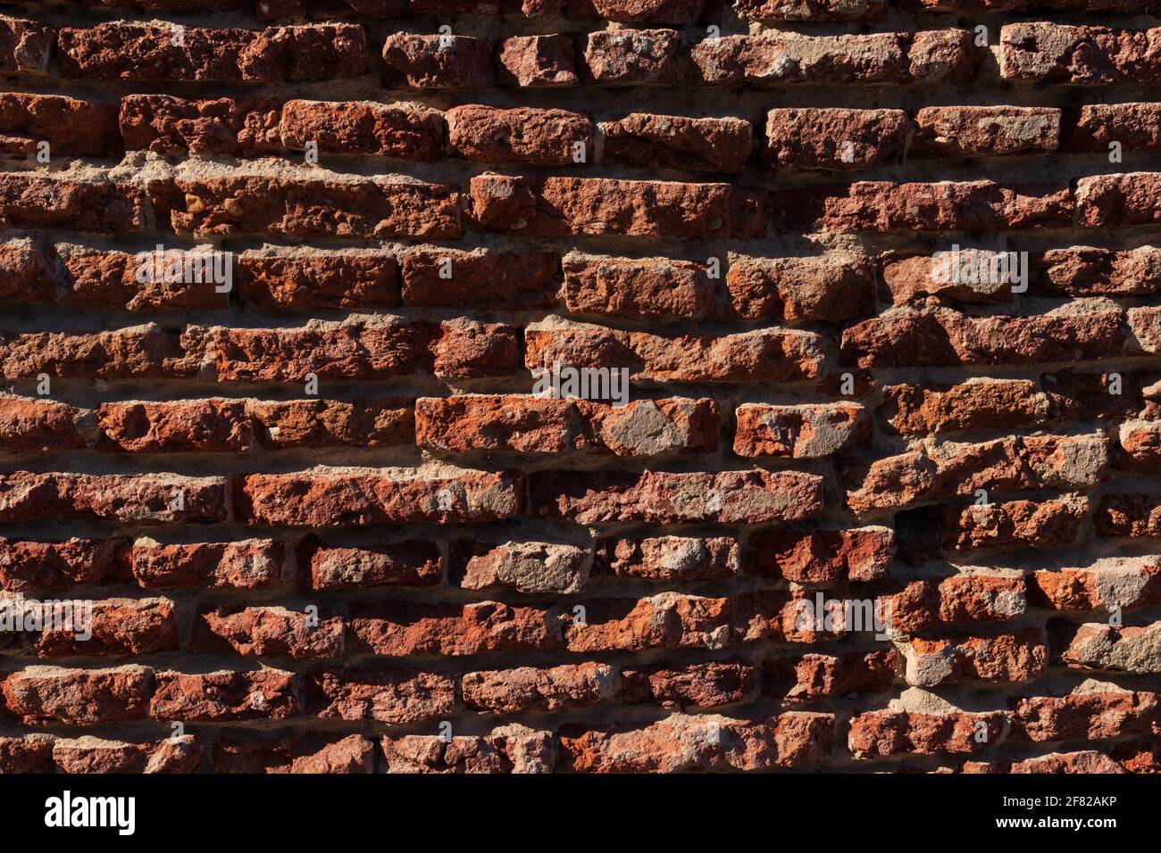 Background with reddish bricks Stock Photo - Alamy