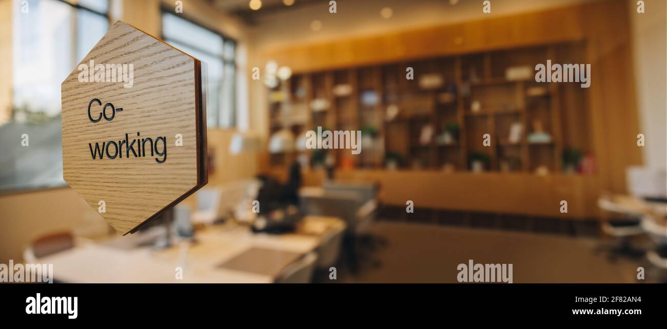 Panorama view of office space with sign board co-working. Co-working ...