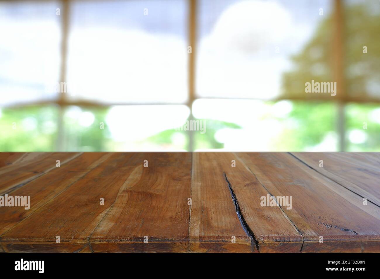 Empty wooden table in front of abstract blurred Cafe, restaurant at ...