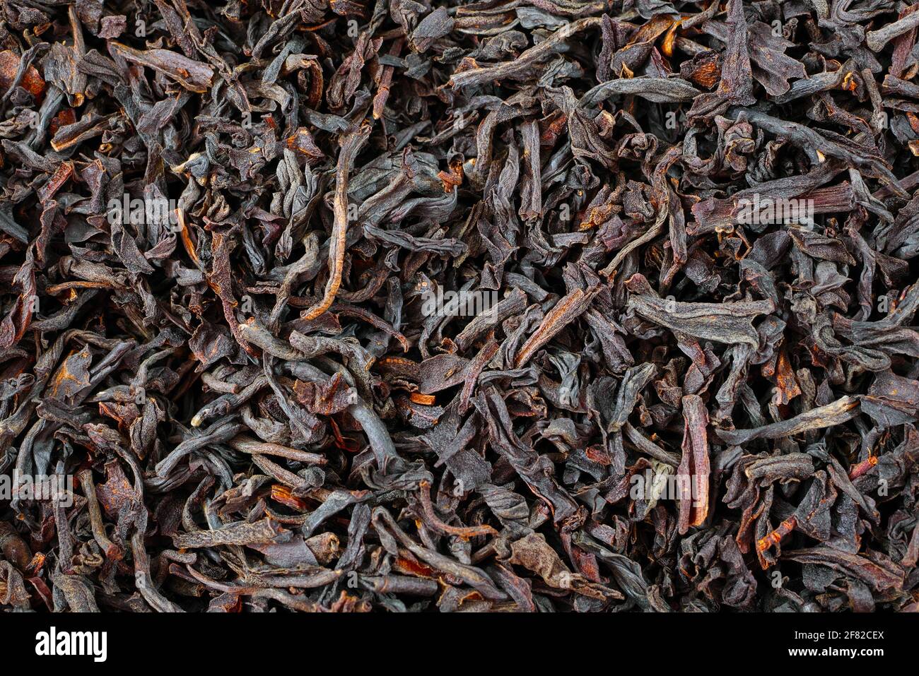 macro of black loose long leaf tea, top view, loose tea texture Stock ...
