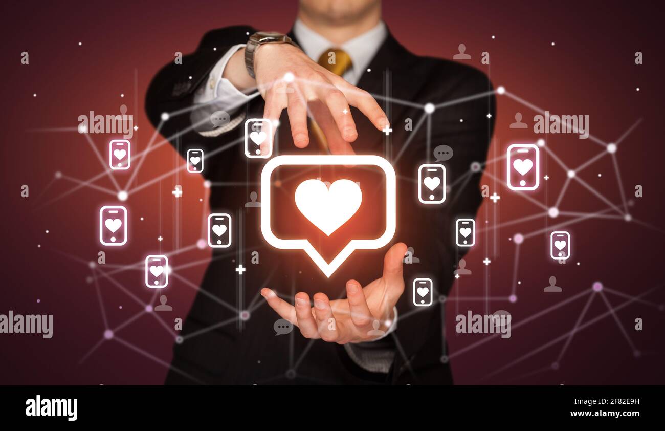 Hand holding social media icons Stock Photo - Alamy