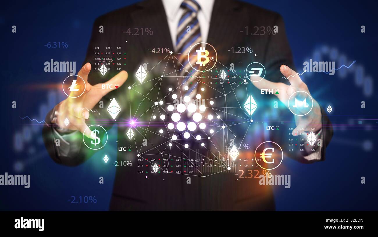 Businessman holding currency symbols concept Stock Photo - Alamy