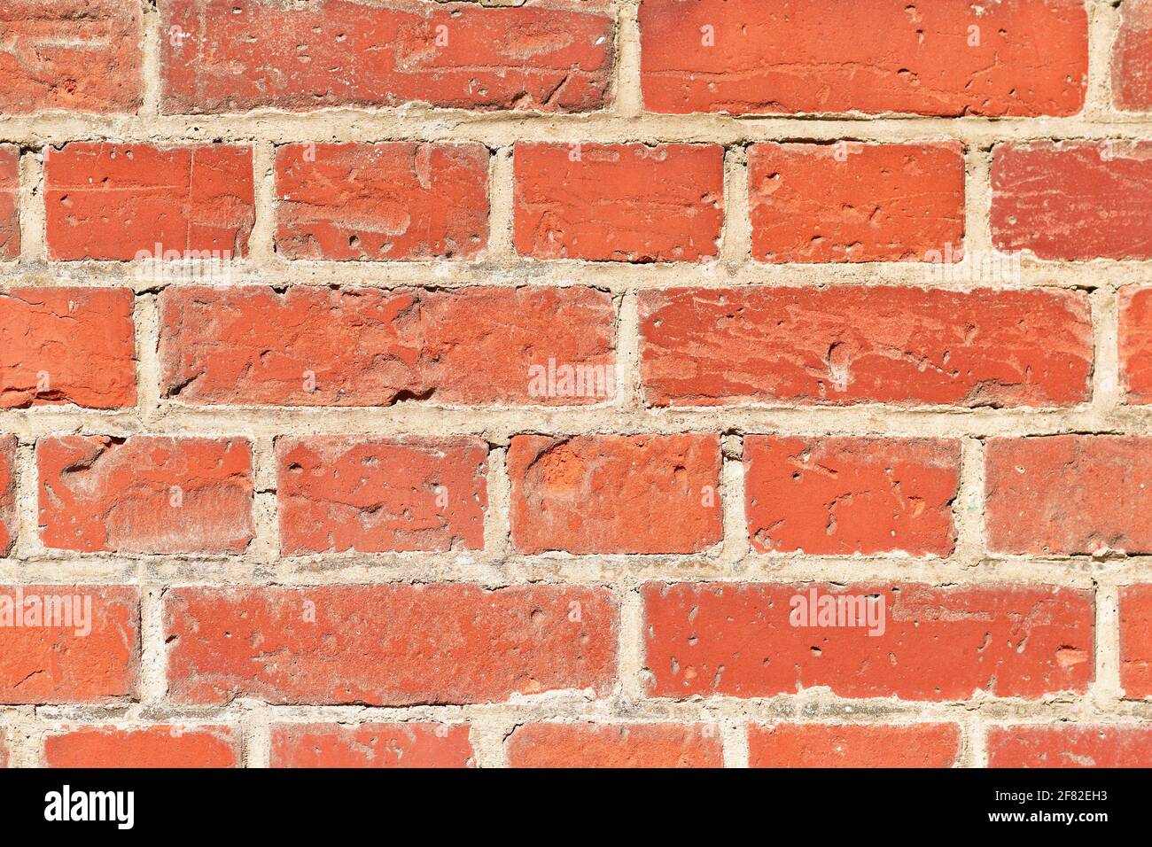Background with old red stone brick wall Stock Photo - Alamy