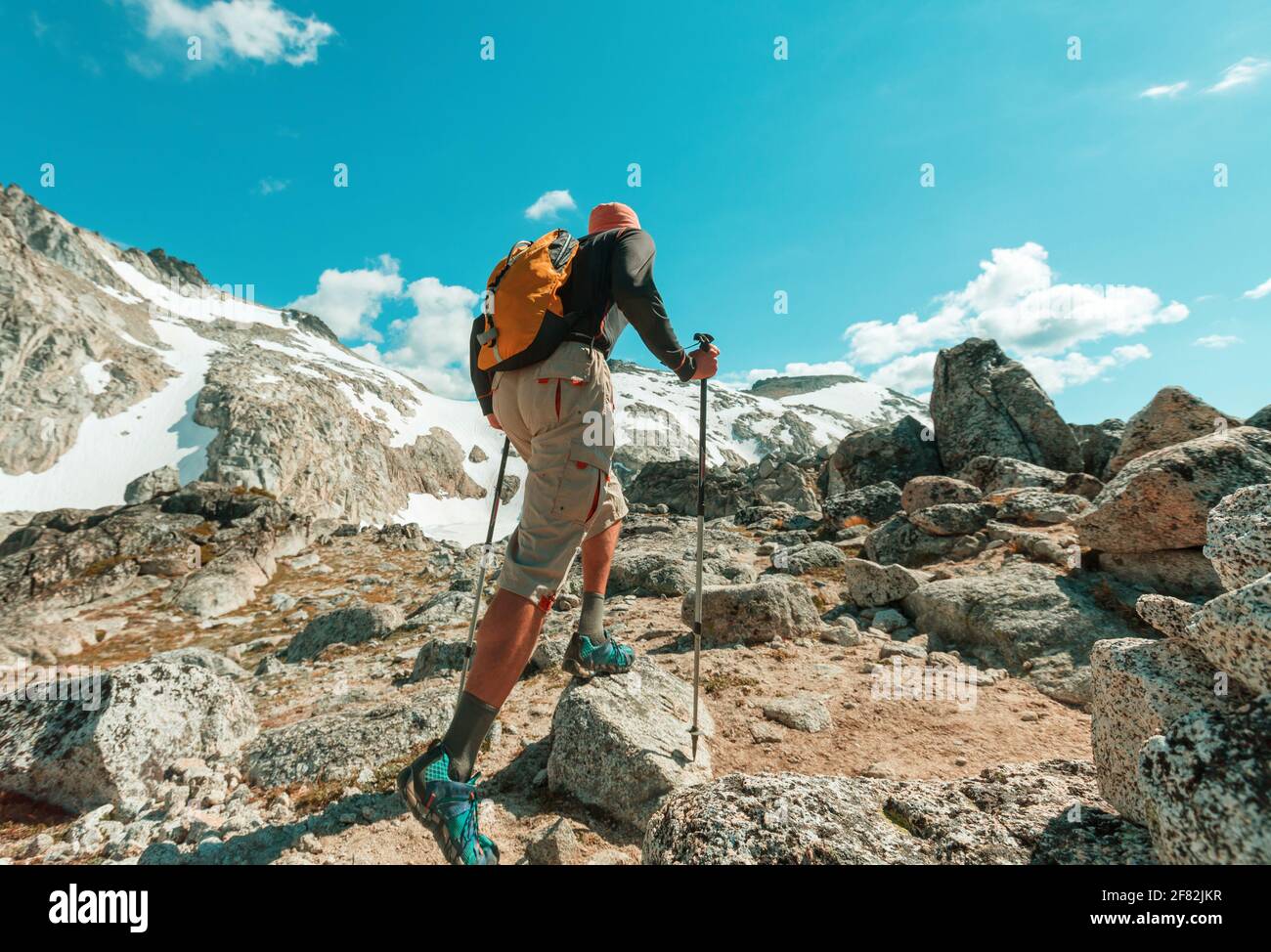 Backpacker in hike in the high mountains Stock Photo - Alamy