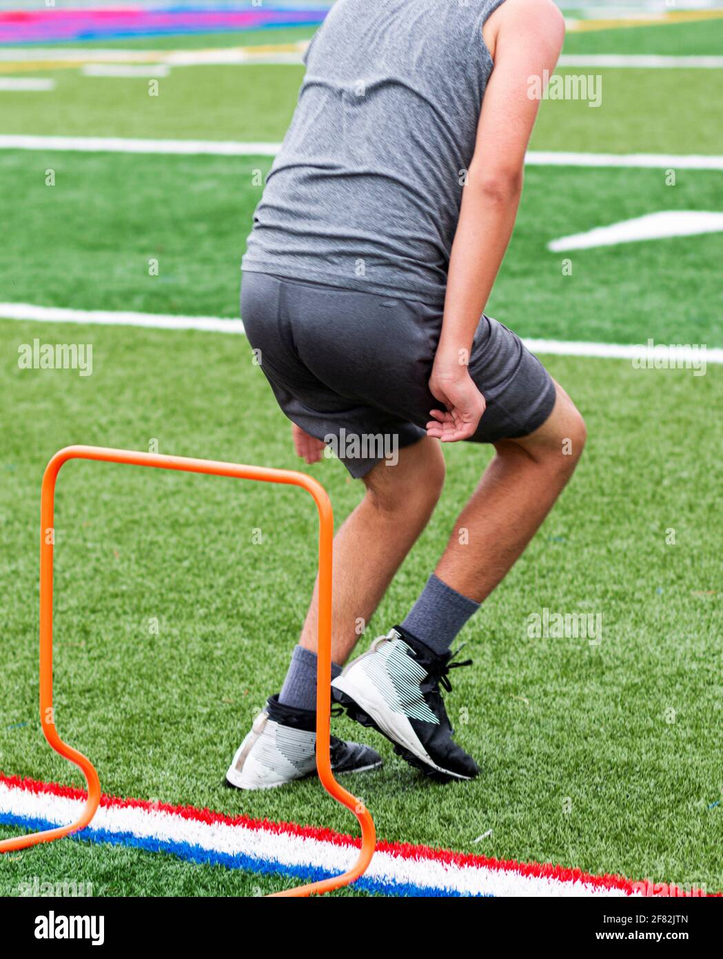 Boy jumping over football hi-res stock photography and images - Alamy