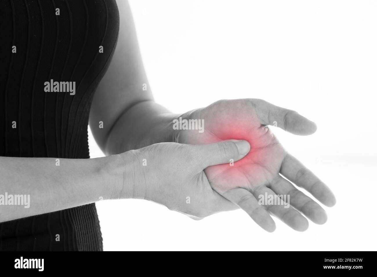 Front view of a young women hand (palm) muscle pain. Red around the ...