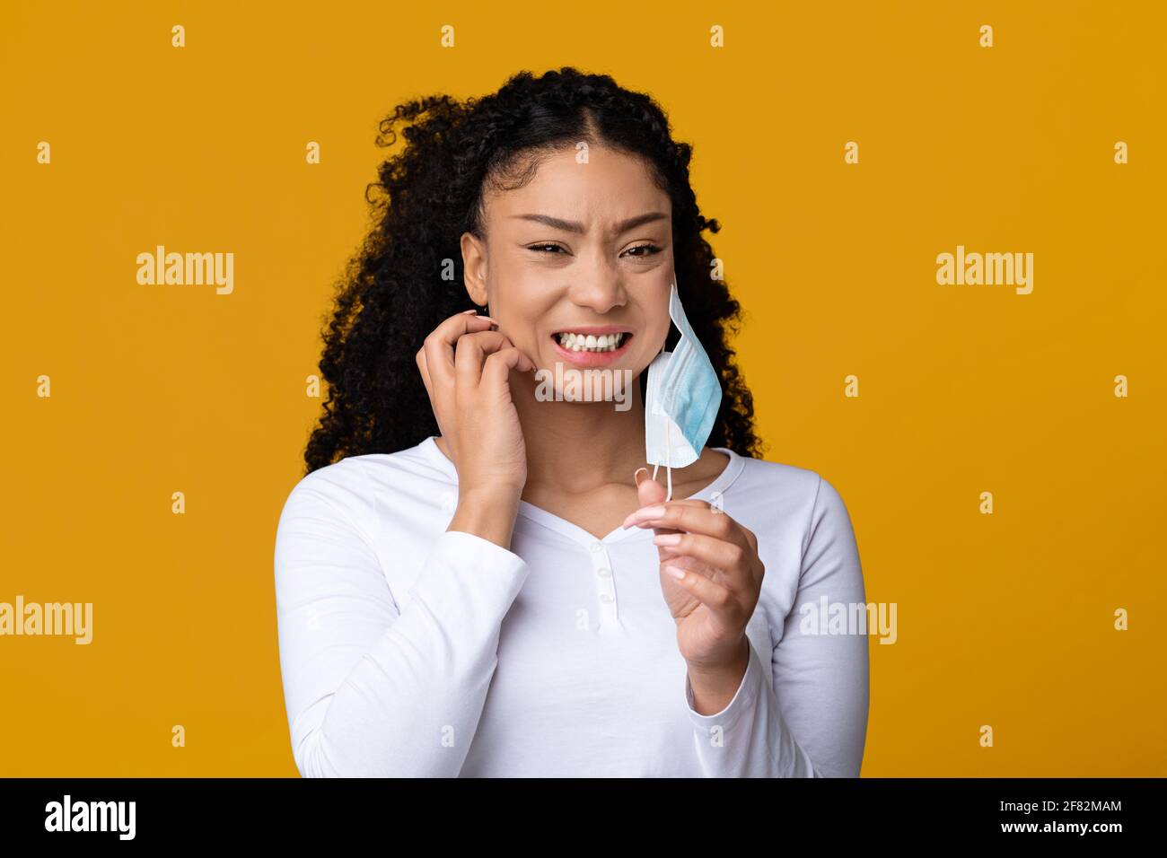 Itchy Skin. Annoyed African American Woman Scratching Face After ...