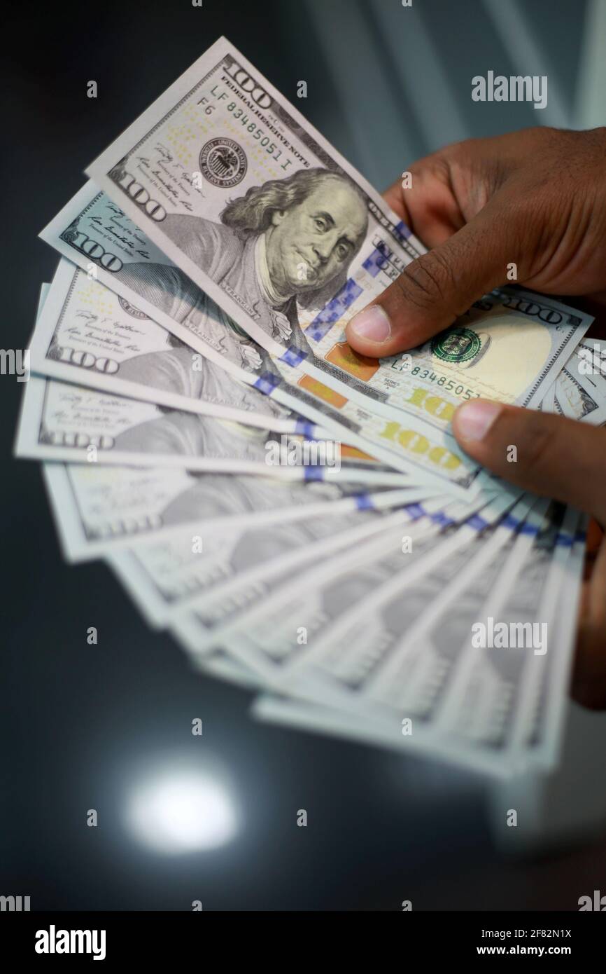 salvador, bahia / brazil - february 11, 2015: Hands hold dollar ...