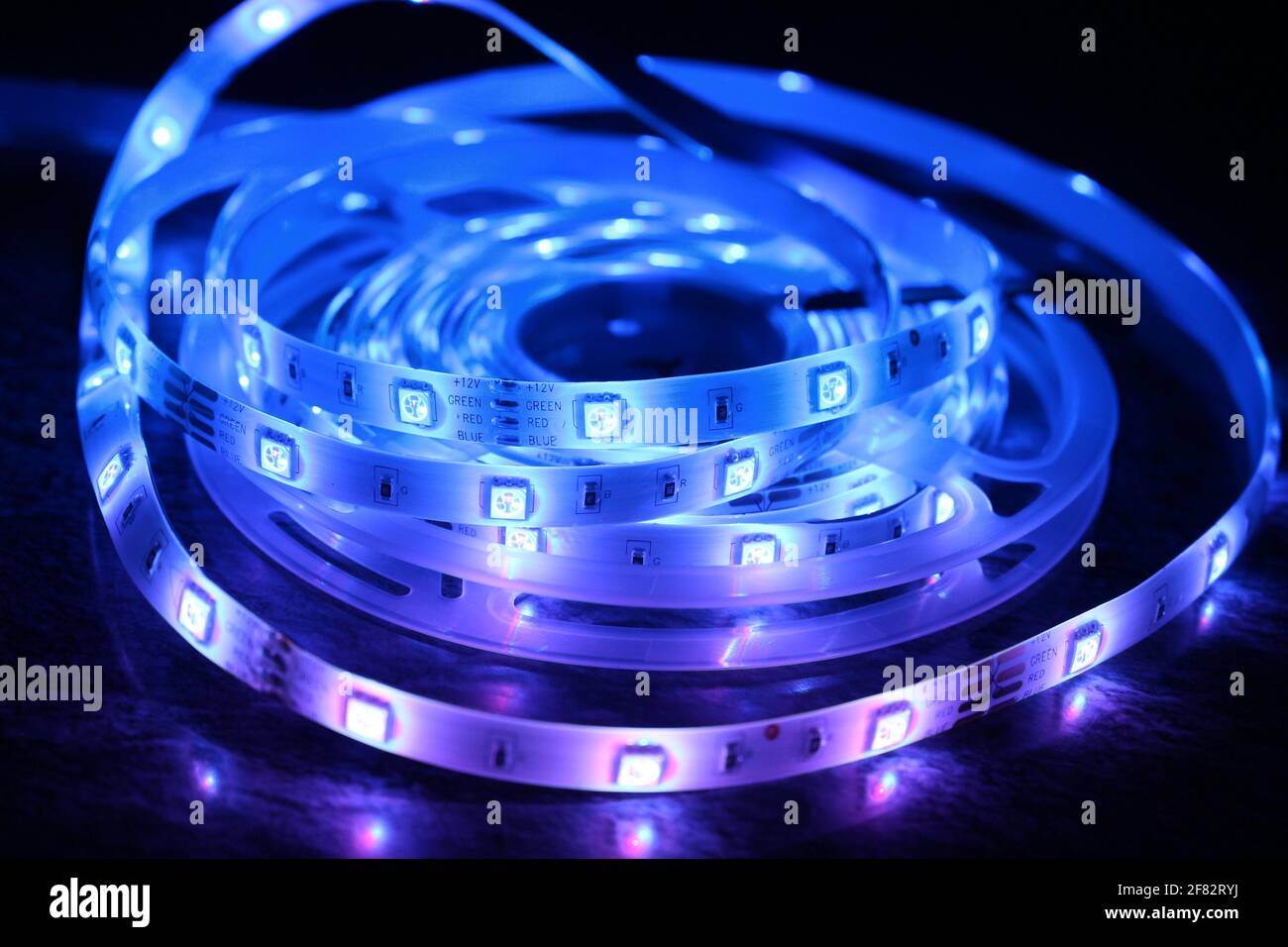 A closeup shot of a roll of illuminated blue led lights Stock Photo - Alamy