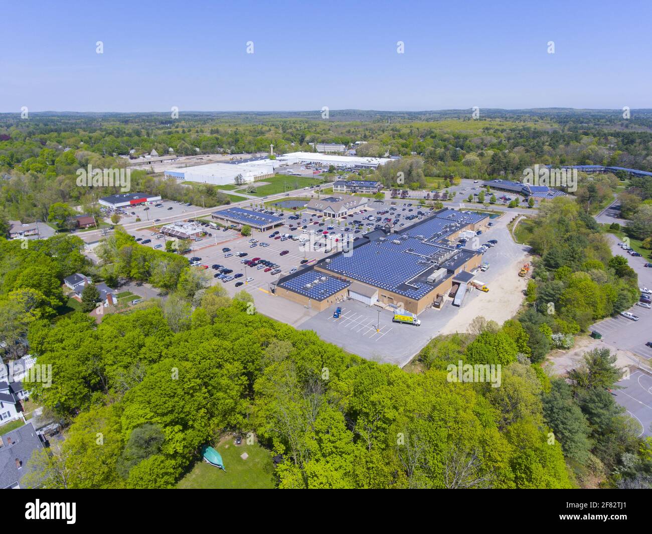 Aerial view of Millis common shopping area and Main Street in spring ...