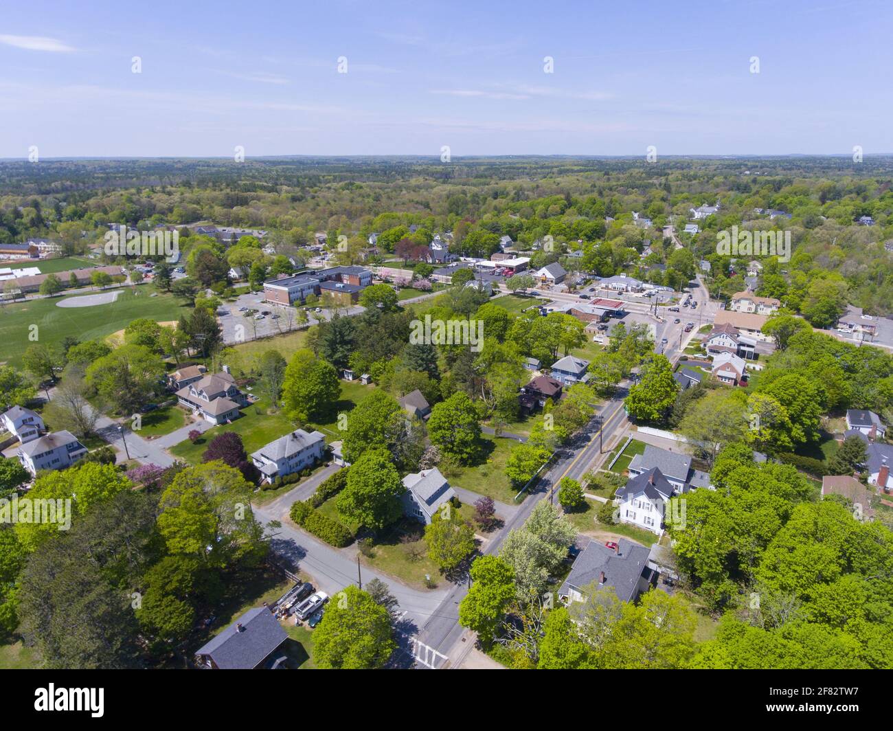 Aerial view of Millis historic town center and Main Street in spring ...