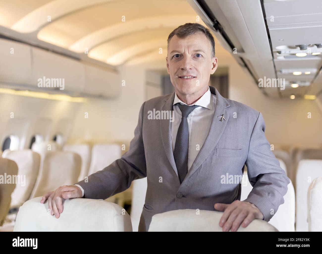Portrait of businessman on an airplane, Passenger Relaxing Stock Photo ...
