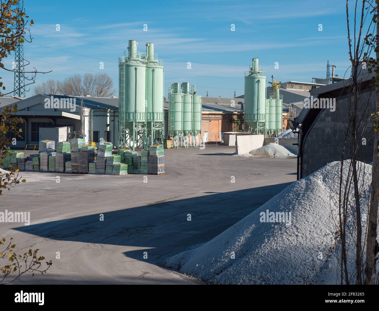 Outdoor Space of a Glass Factory with Vertical Tanks and selected Glass ...
