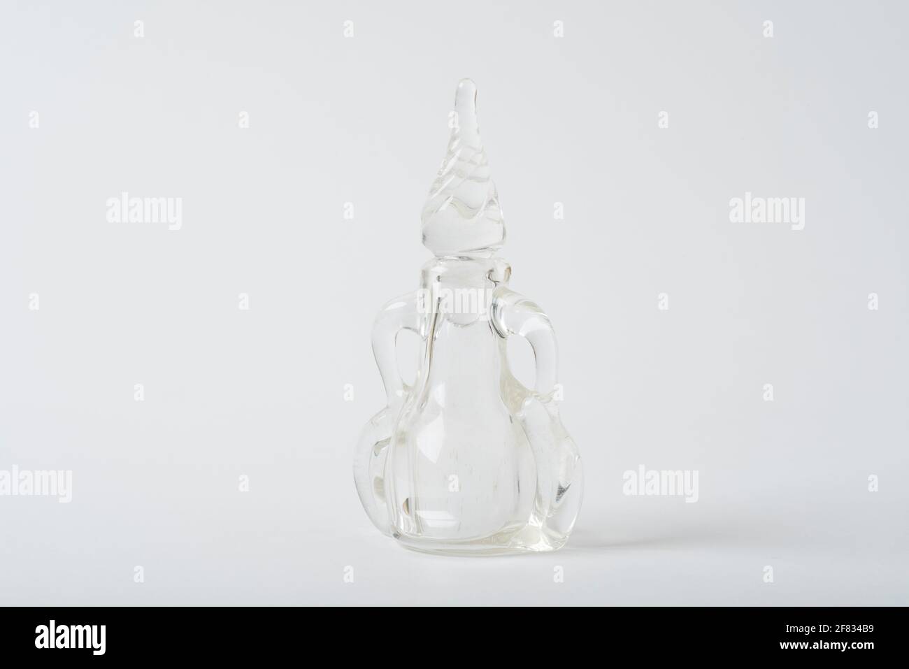 Small, handmade glass container with stopper Stock Photo - Alamy