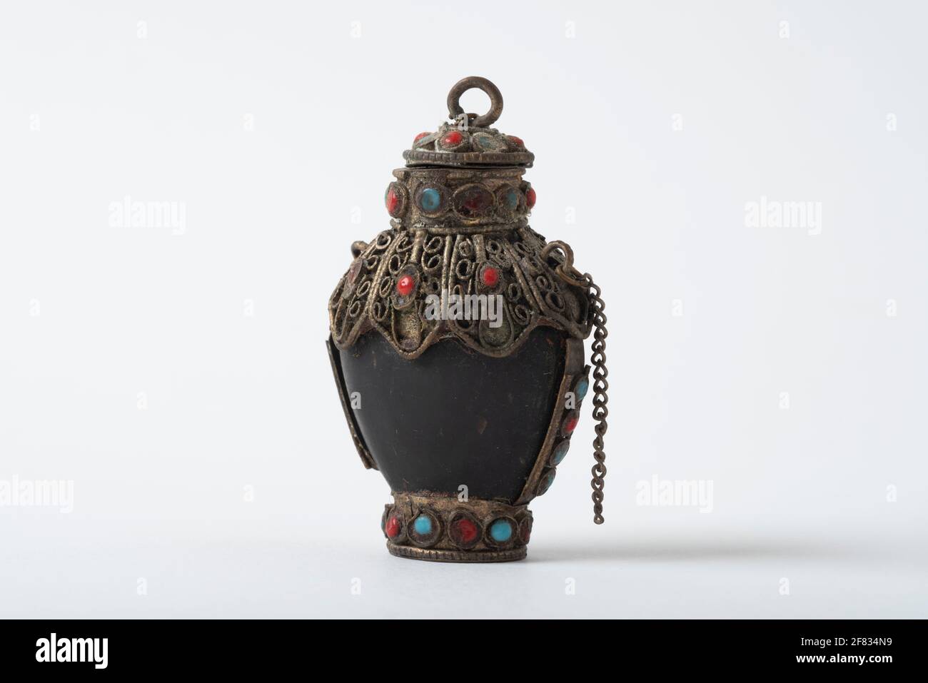 A small, antique snuff container collected in Bhutan, but of Tibetan ...