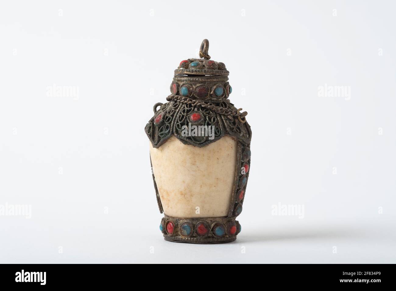 A small, antique snuff container collected in Bhutan, but of Tibetan ...