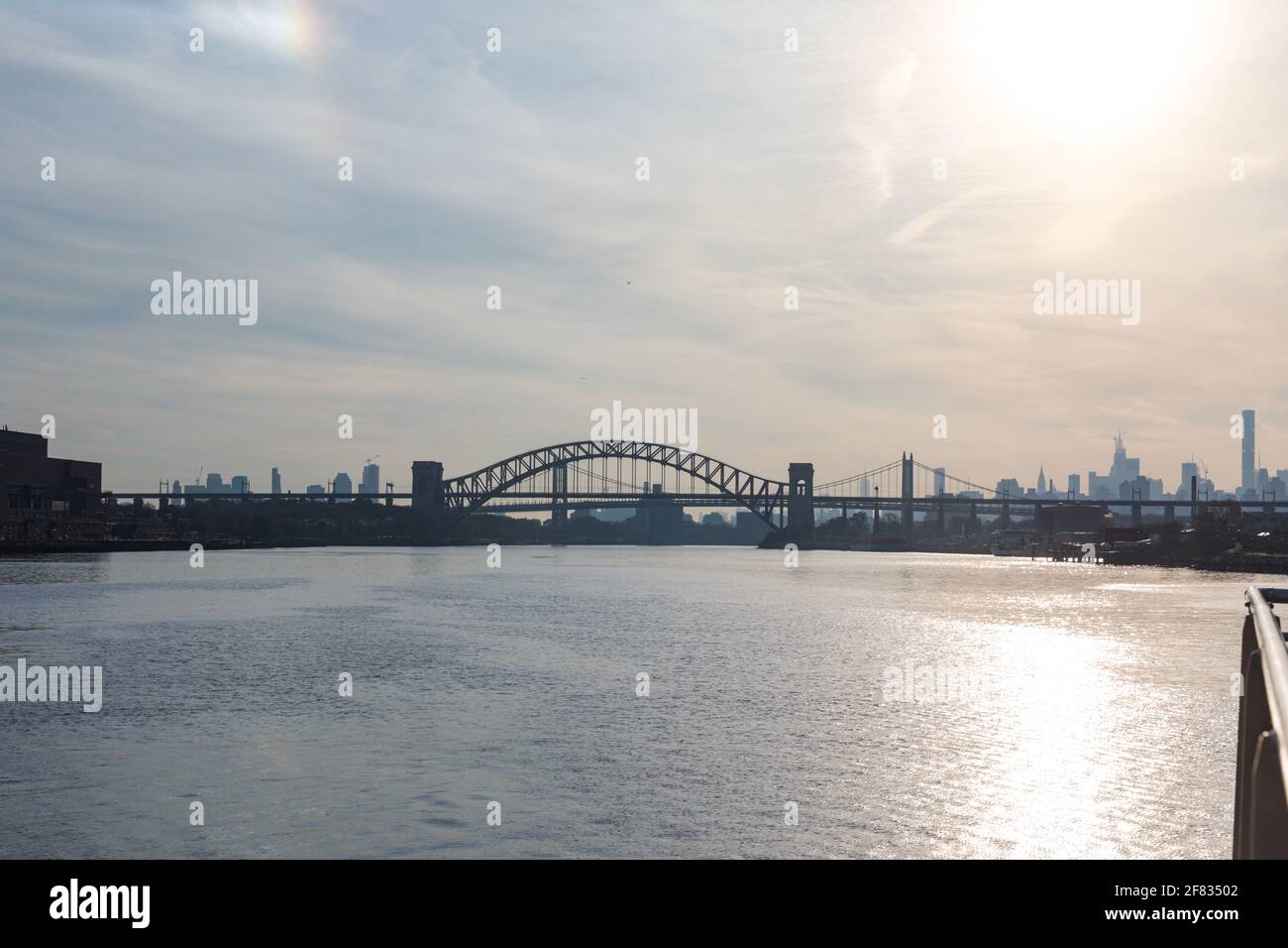 view of a bridge in the distance in a wide city with tall buildings ...