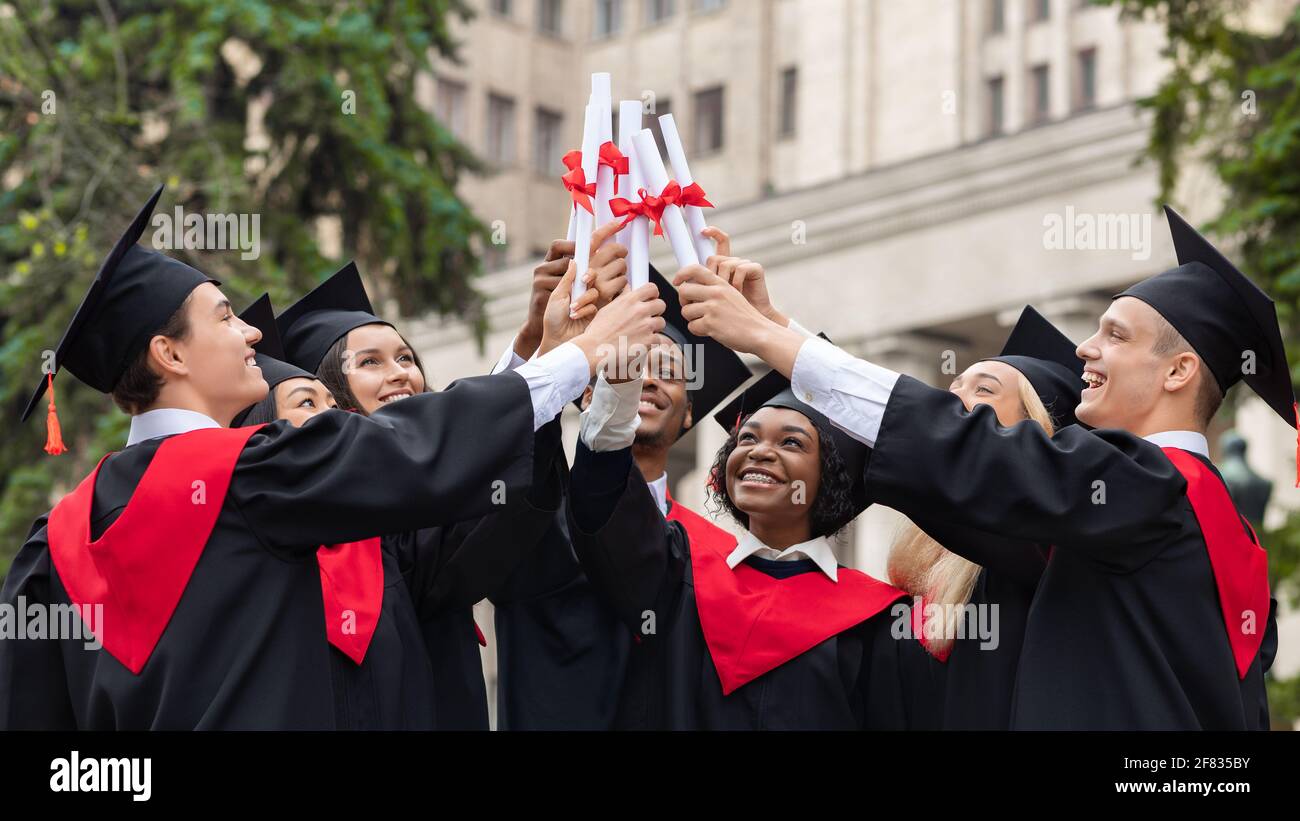 Group diverse students celebrating graduation hi-res stock photography ...