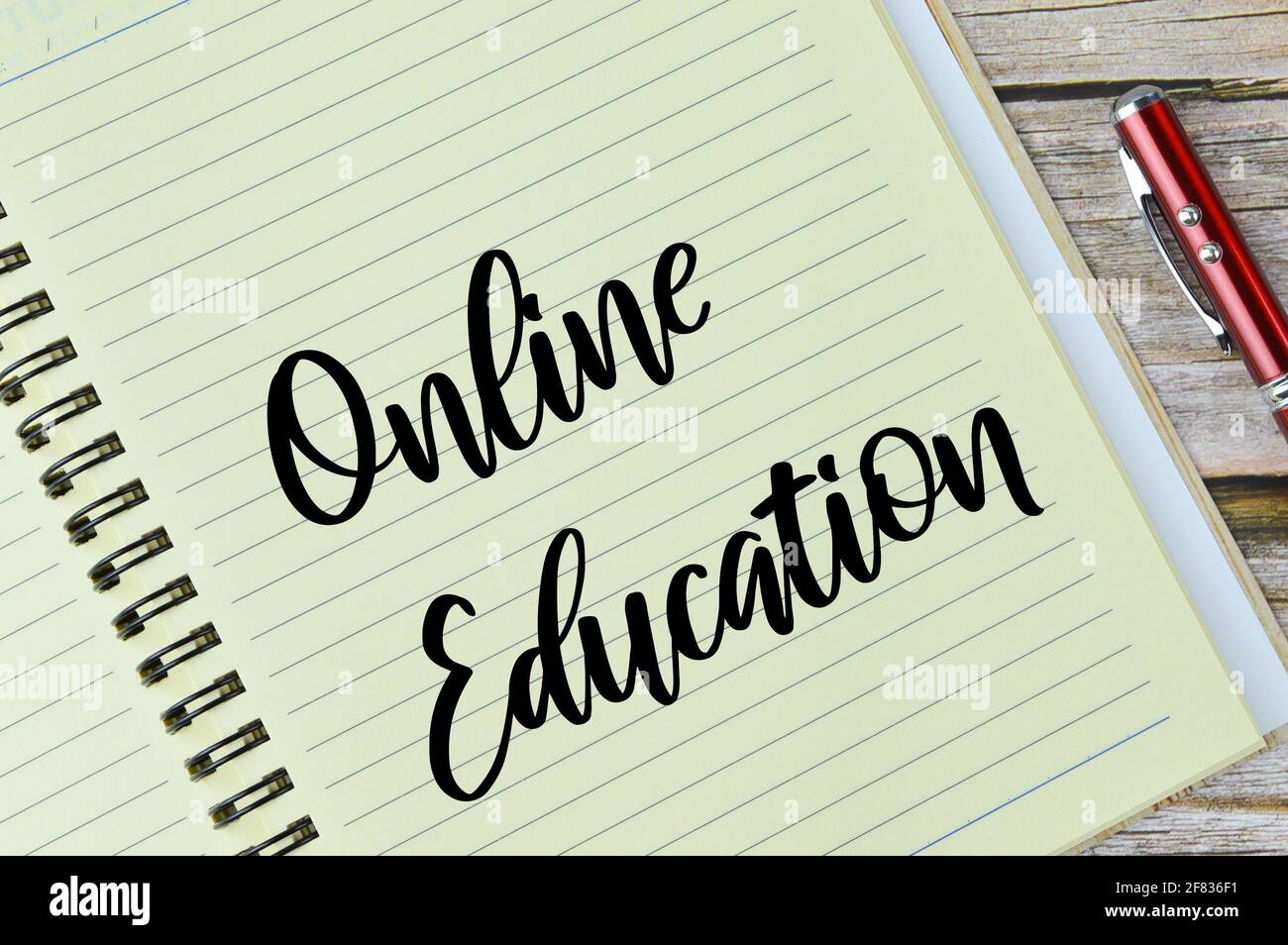 Top of notebook written with text ONLINE EDUCATION Stock Photo - Alamy