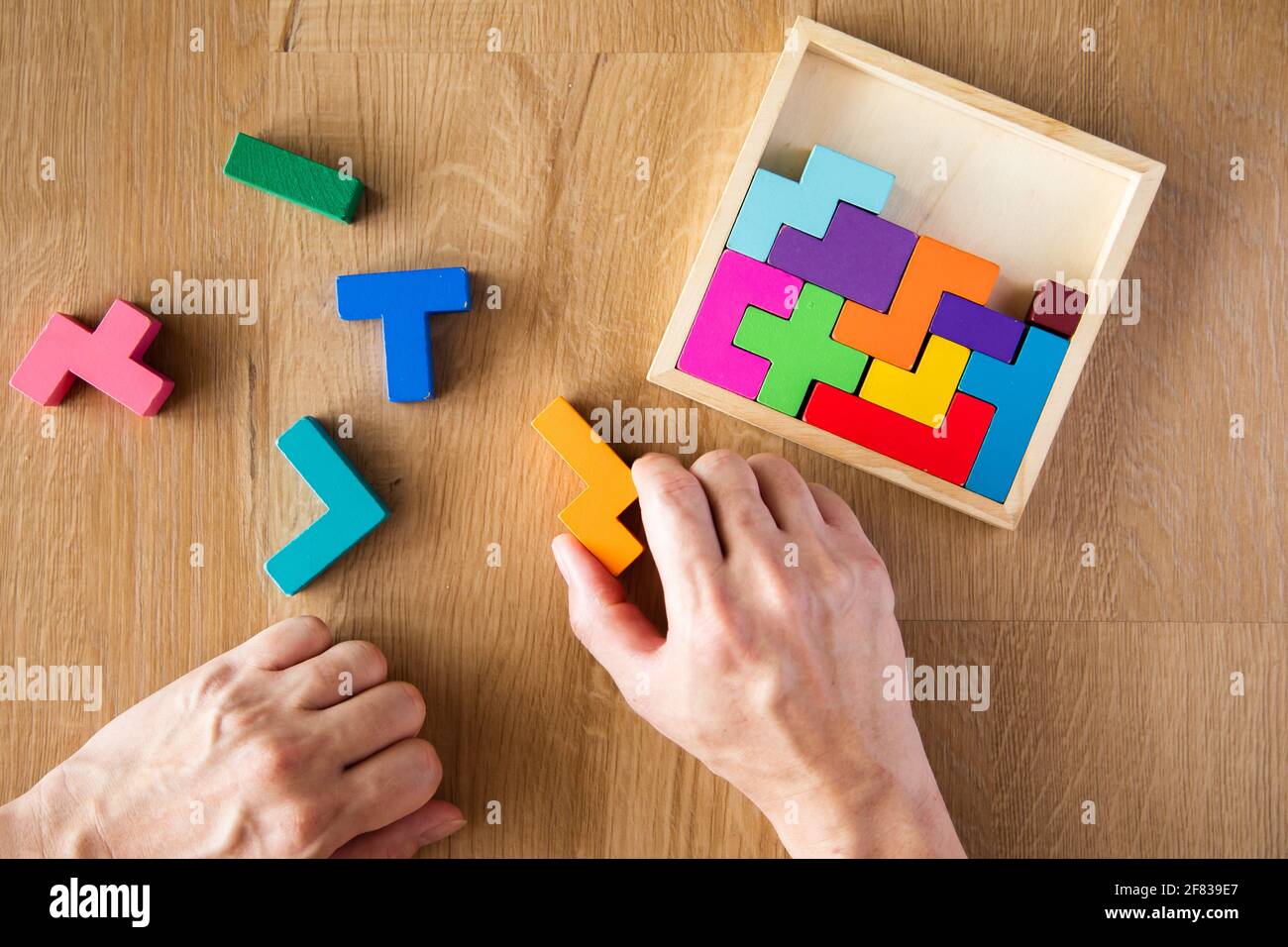 hand put wooden blocks arranging for finishing task Stock Photo - Alamy