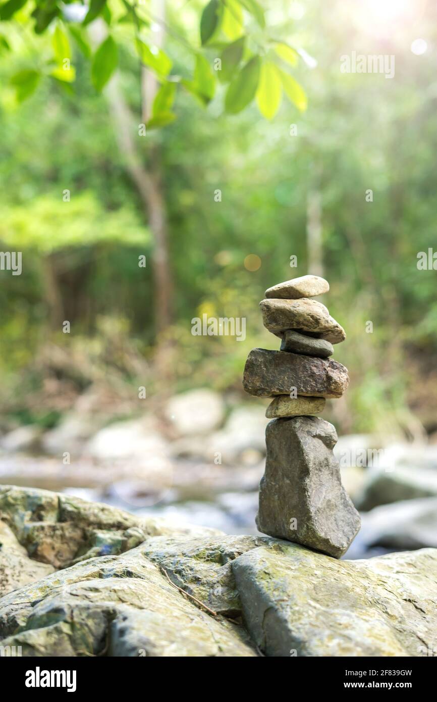 Stacked rocks beside the stream in the forest Stock Photo - Alamy