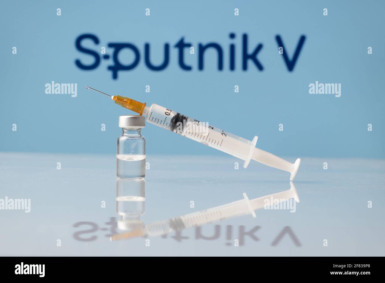 Sputnik V Coronavirus Vaccine vial and syringe with logo as background ...