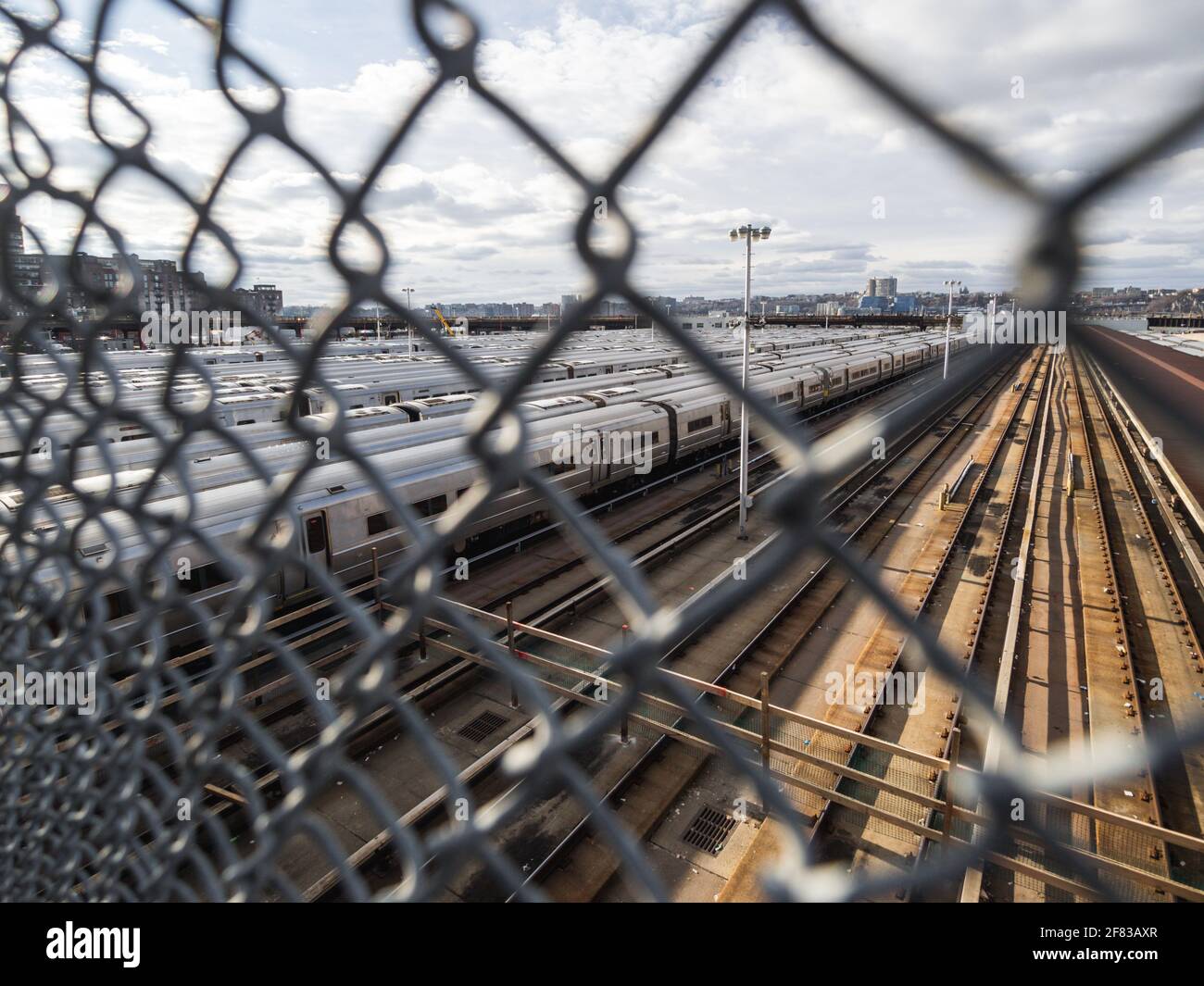 silver trains parked at a terminal in a big city Stock Photo - Alamy