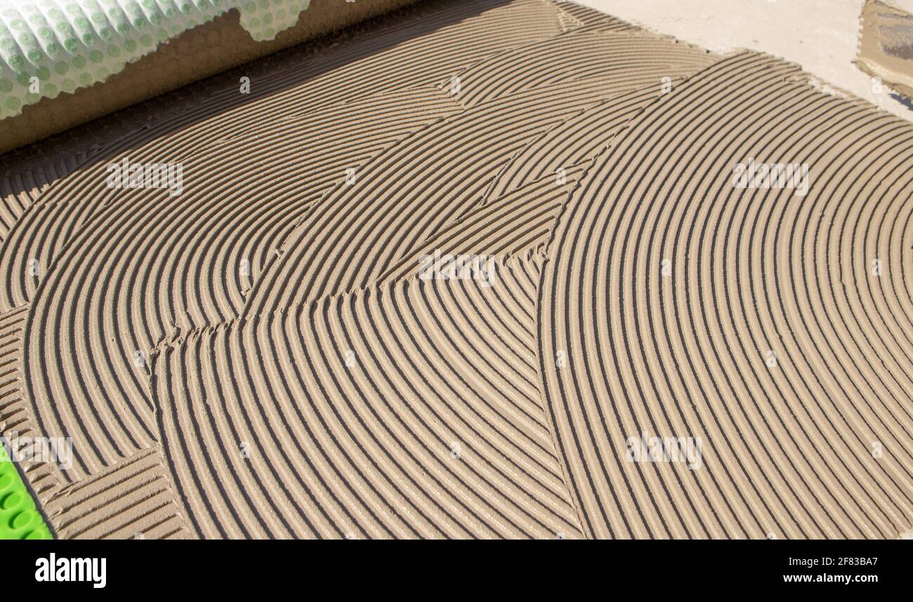 Applying tile mosaic hi-res stock photography and images - Alamy