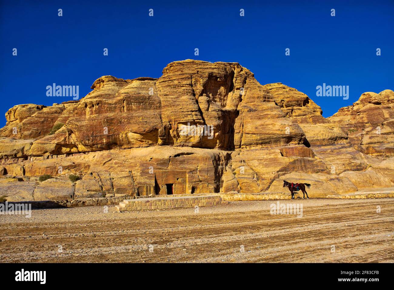 The Siq, the main road that leads to the city, starts from the Dam and ...