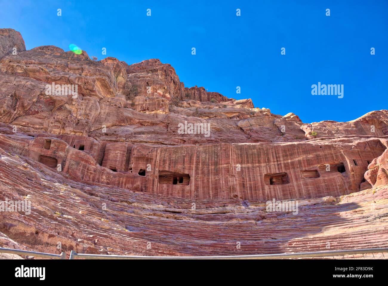 The caves along the back of the theater most likely come from older ...