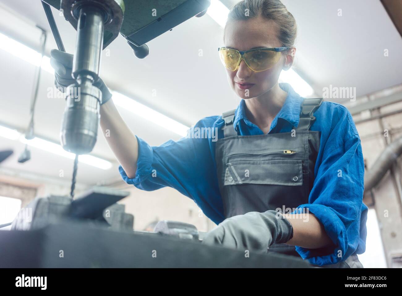 Technician using precision drill hi-res stock photography and images ...