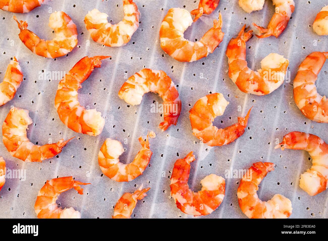 Peeled cooked tiger prawns on tray Stock Photo - Alamy
