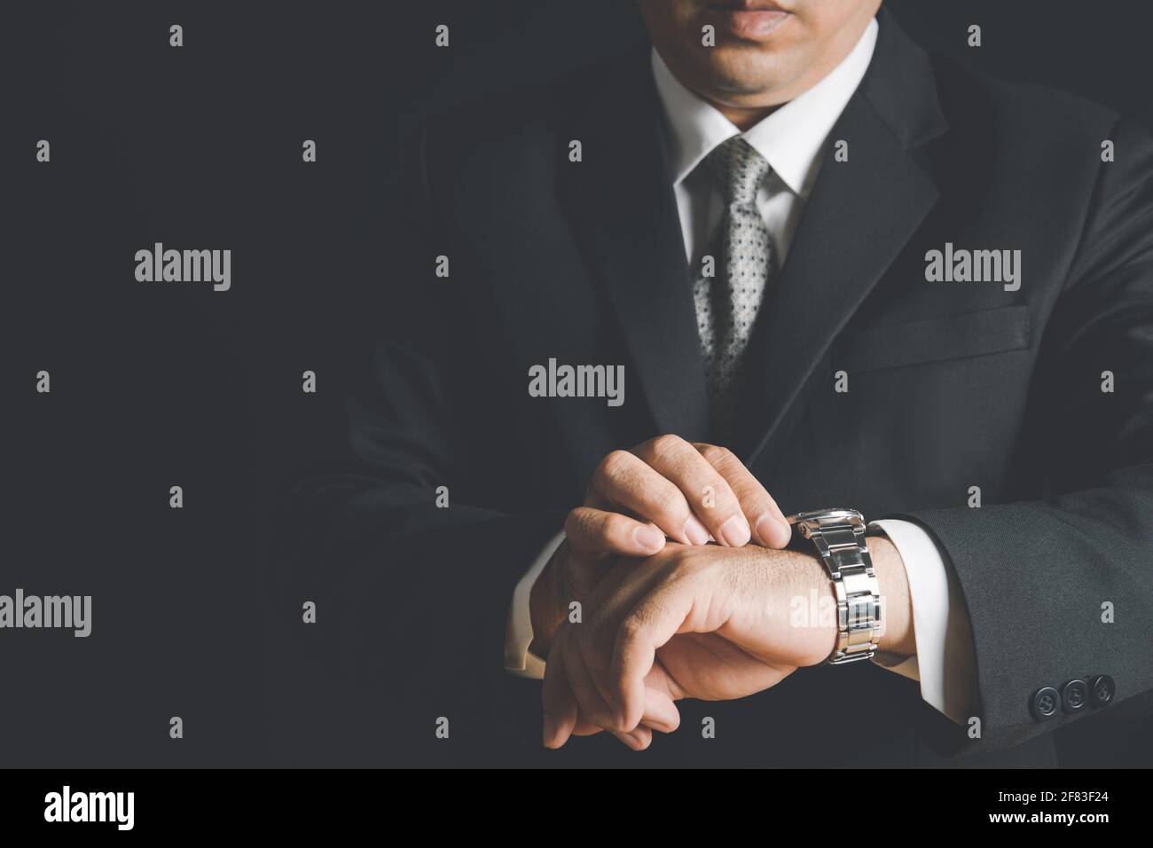 Businessman watching wrist watch hi-res stock photography and images ...