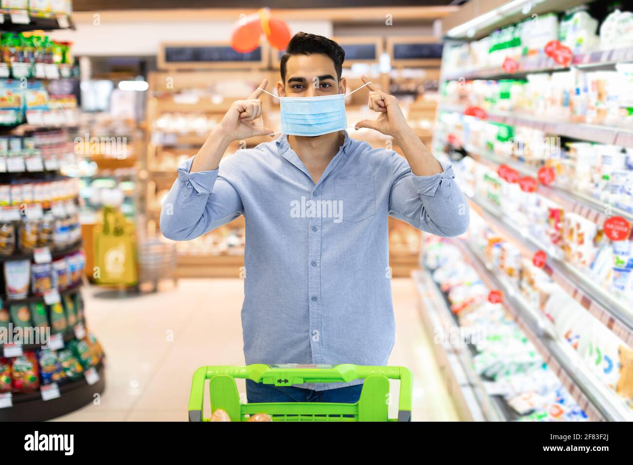 Arabic Man Wearing Protective Face Mask Buying Food In Supermarket ...
