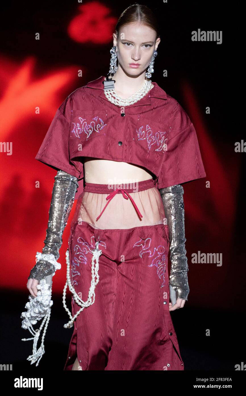 A model walks the runway at the Guillermo Decimo fashion show during ...