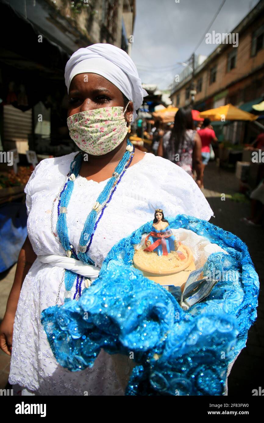 salvador, bahia, brazil - january 27, 2021: adept of Candomble carries ...