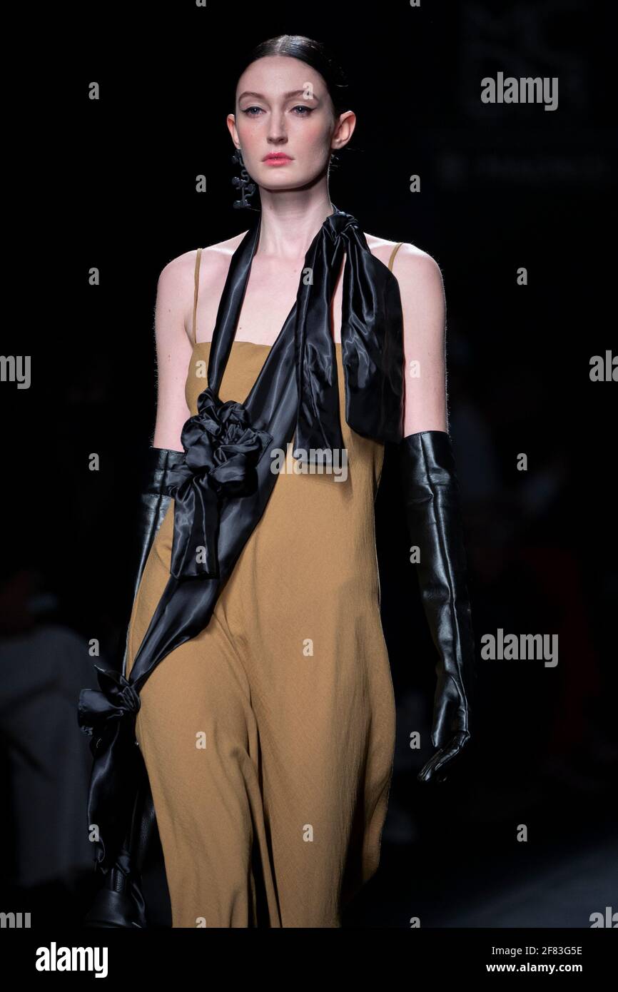Madrid, Spain. 11th Apr, 2021. A model walks the runway at the ...