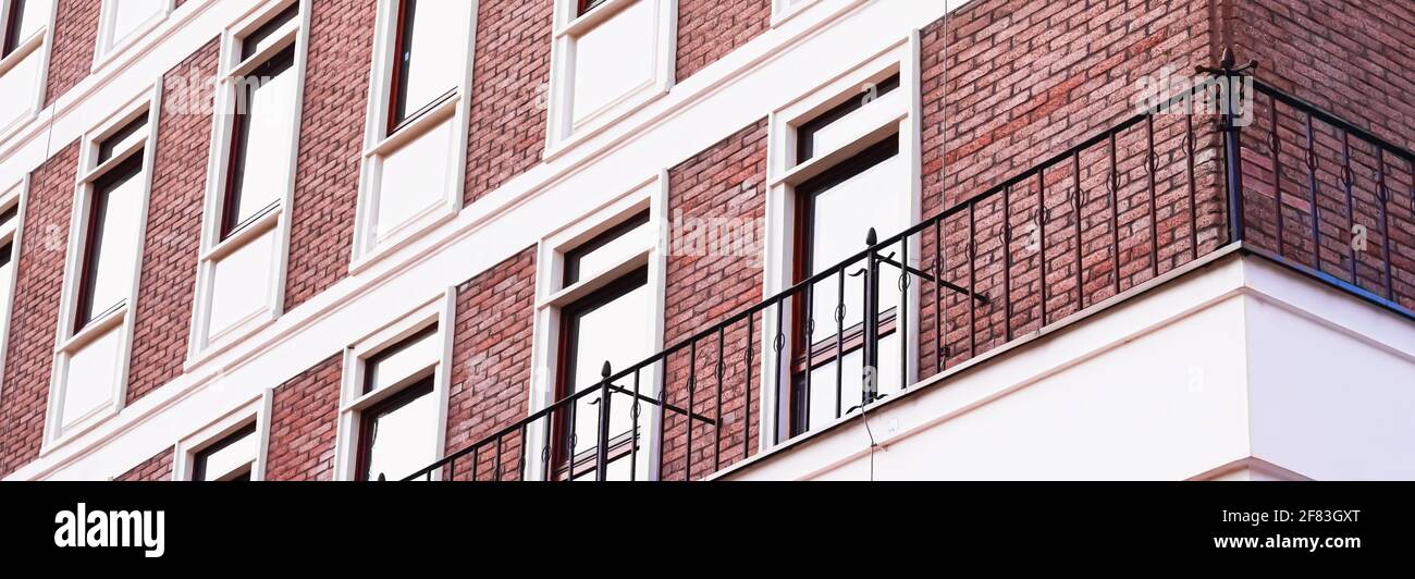 Classic architecture, old building brick facade and windows ...
